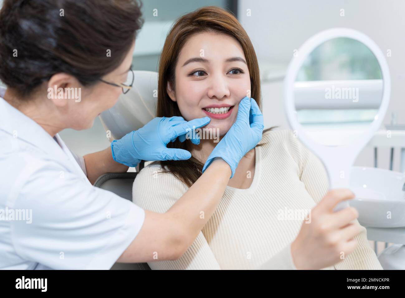 Doctors and patients in dental clinic Stock Photo - Alamy