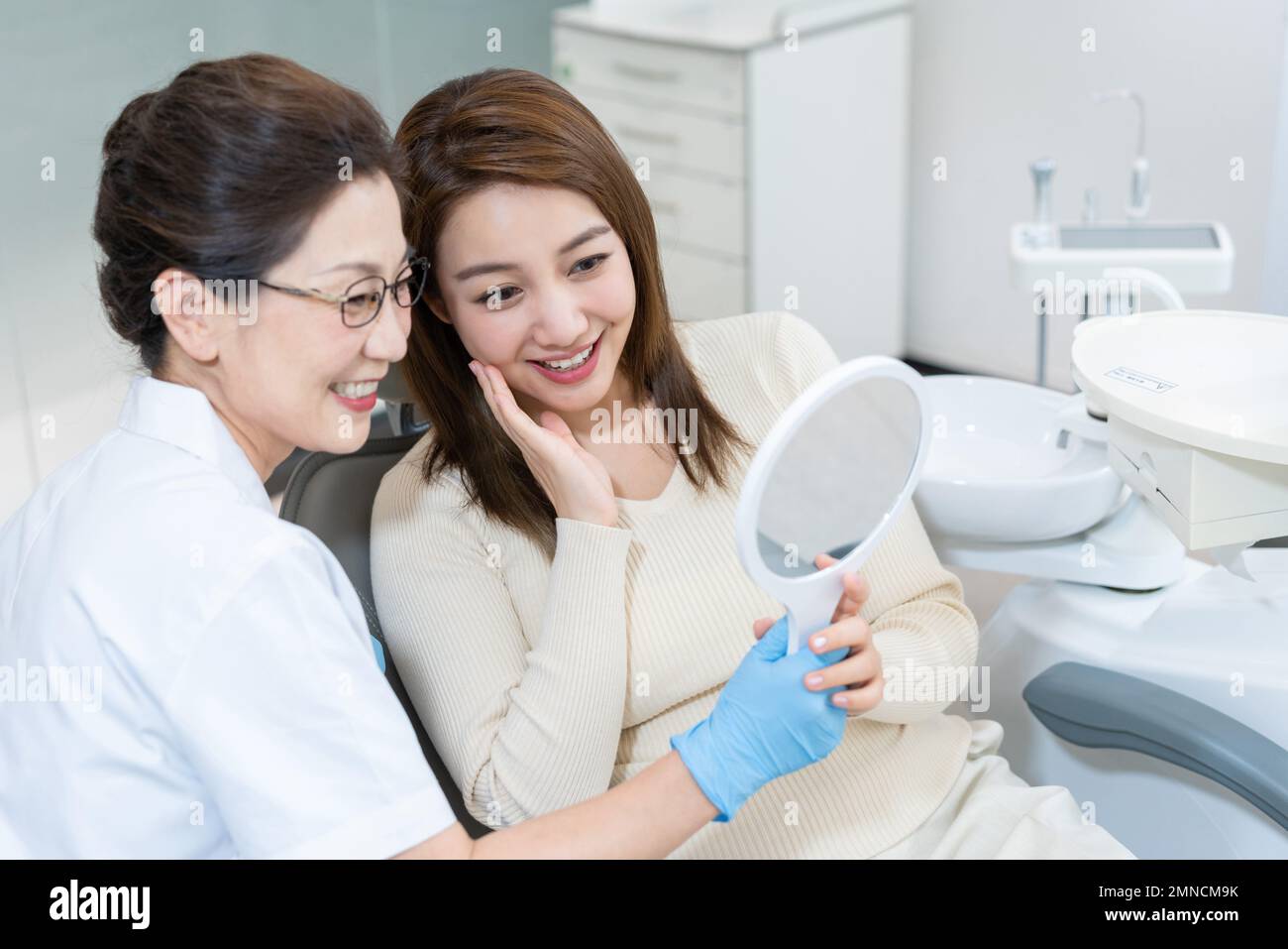 Doctors give patients in the dental clinic matching teeth Stock Photo ...