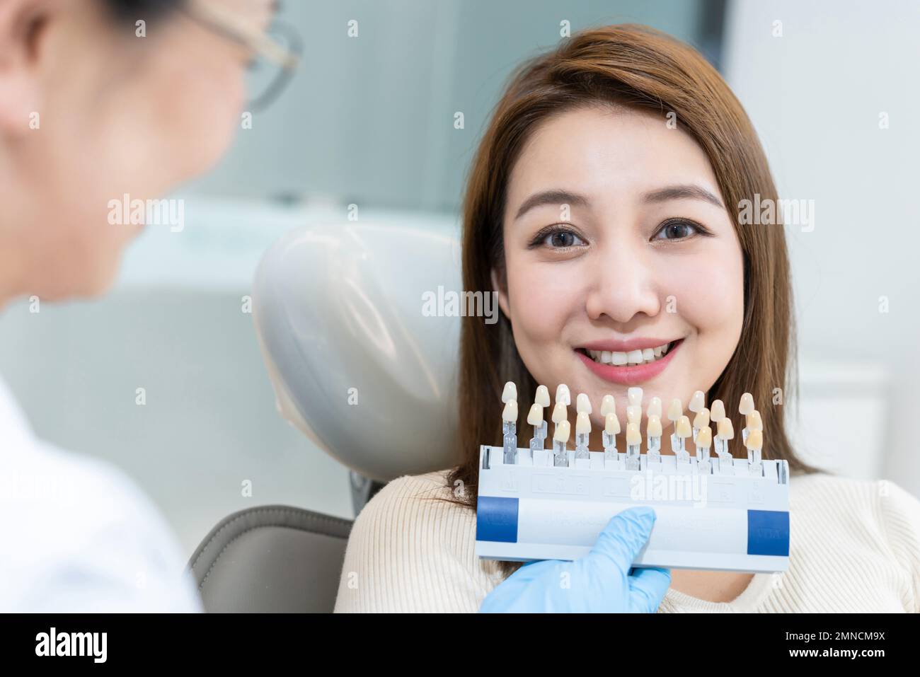 Doctors give patients in the dental clinic matching teeth Stock Photo ...