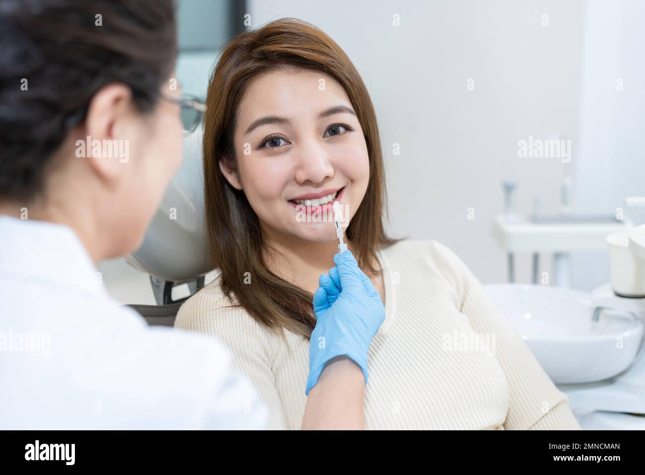 Doctors give patients in the dental clinic matching teeth Stock Photo ...
