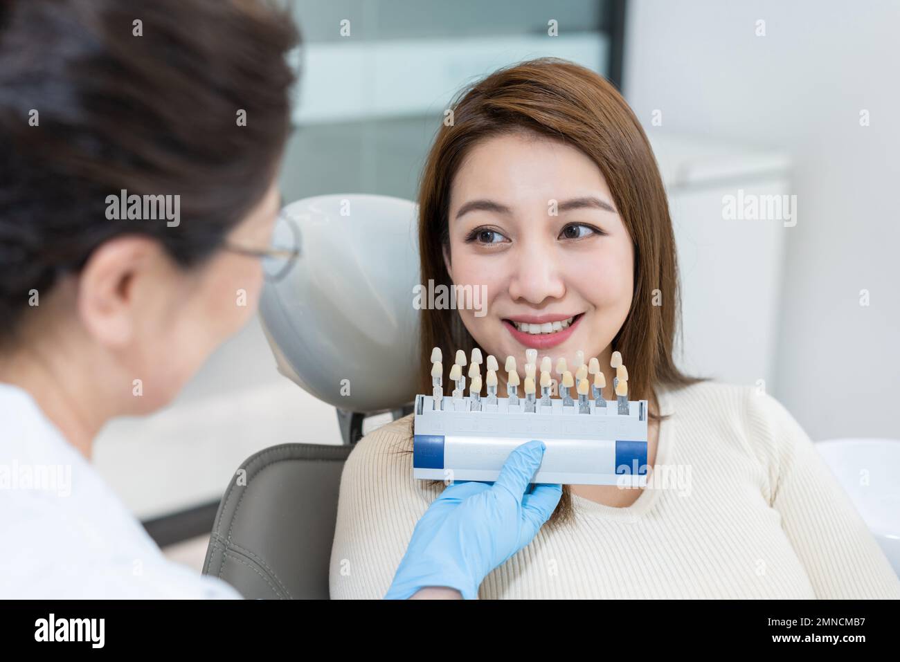 Doctors give patients in the dental clinic matching teeth Stock Photo ...