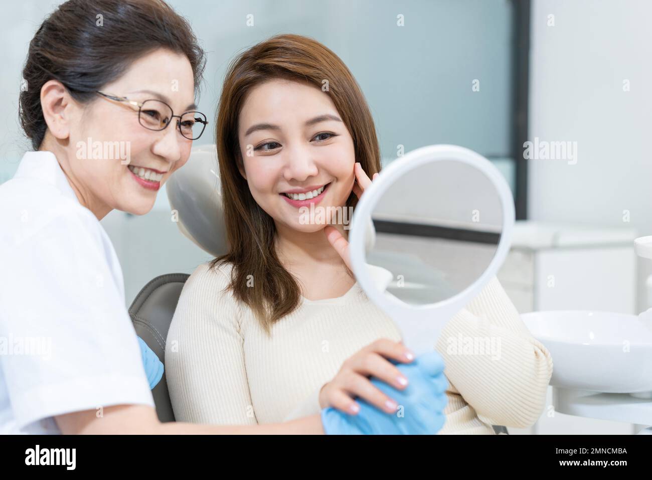 Doctors give patients in the dental clinic matching teeth Stock Photo ...
