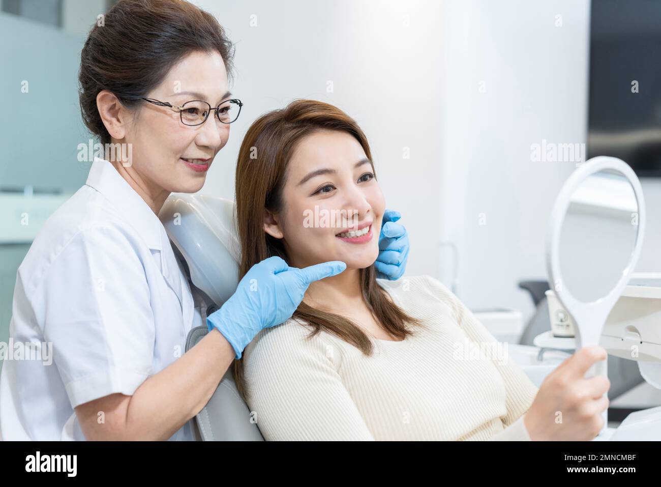Doctors give patients in the dental clinic matching teeth Stock Photo ...