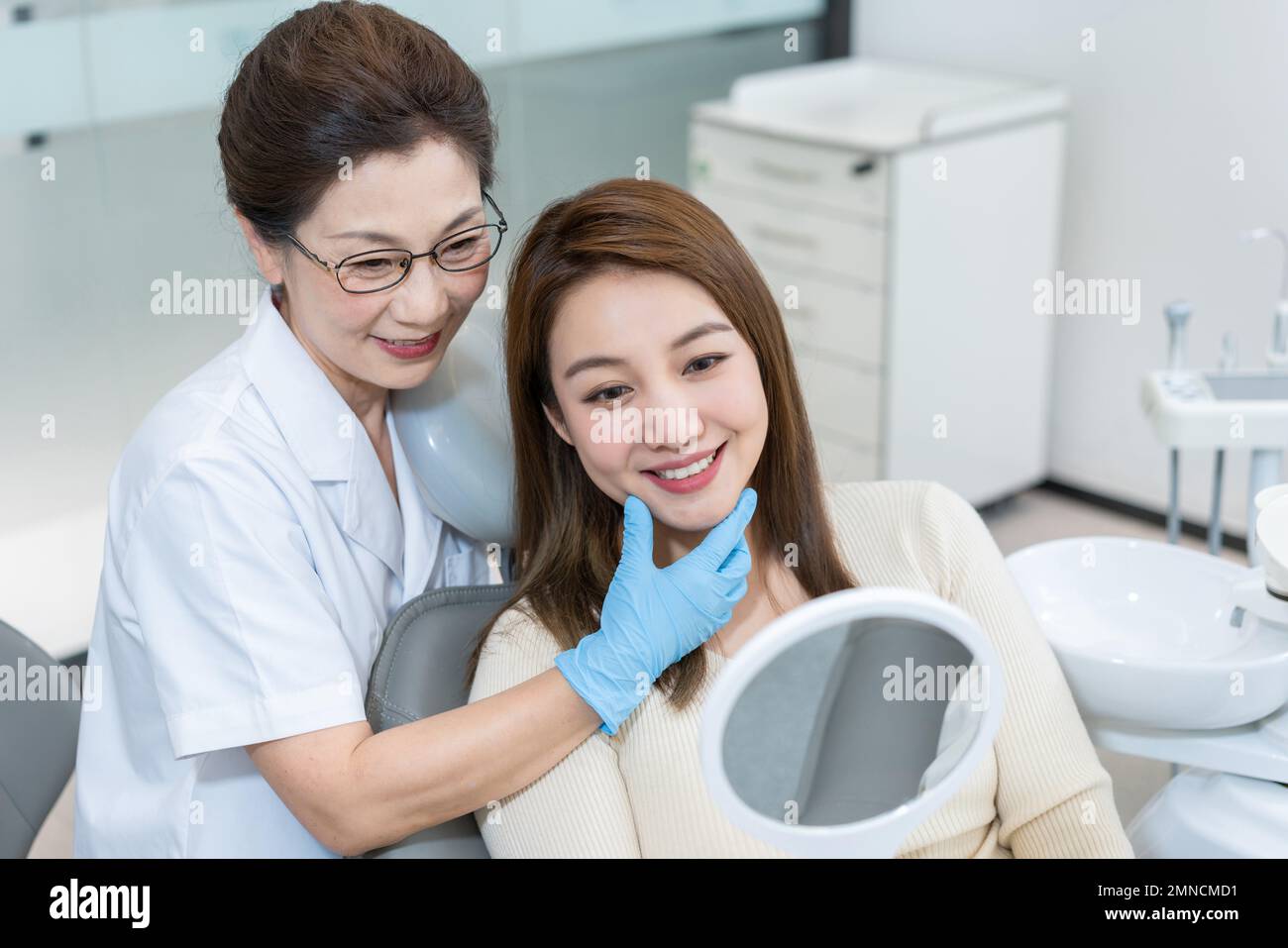 Doctors give patients in the dental clinic matching teeth Stock Photo ...
