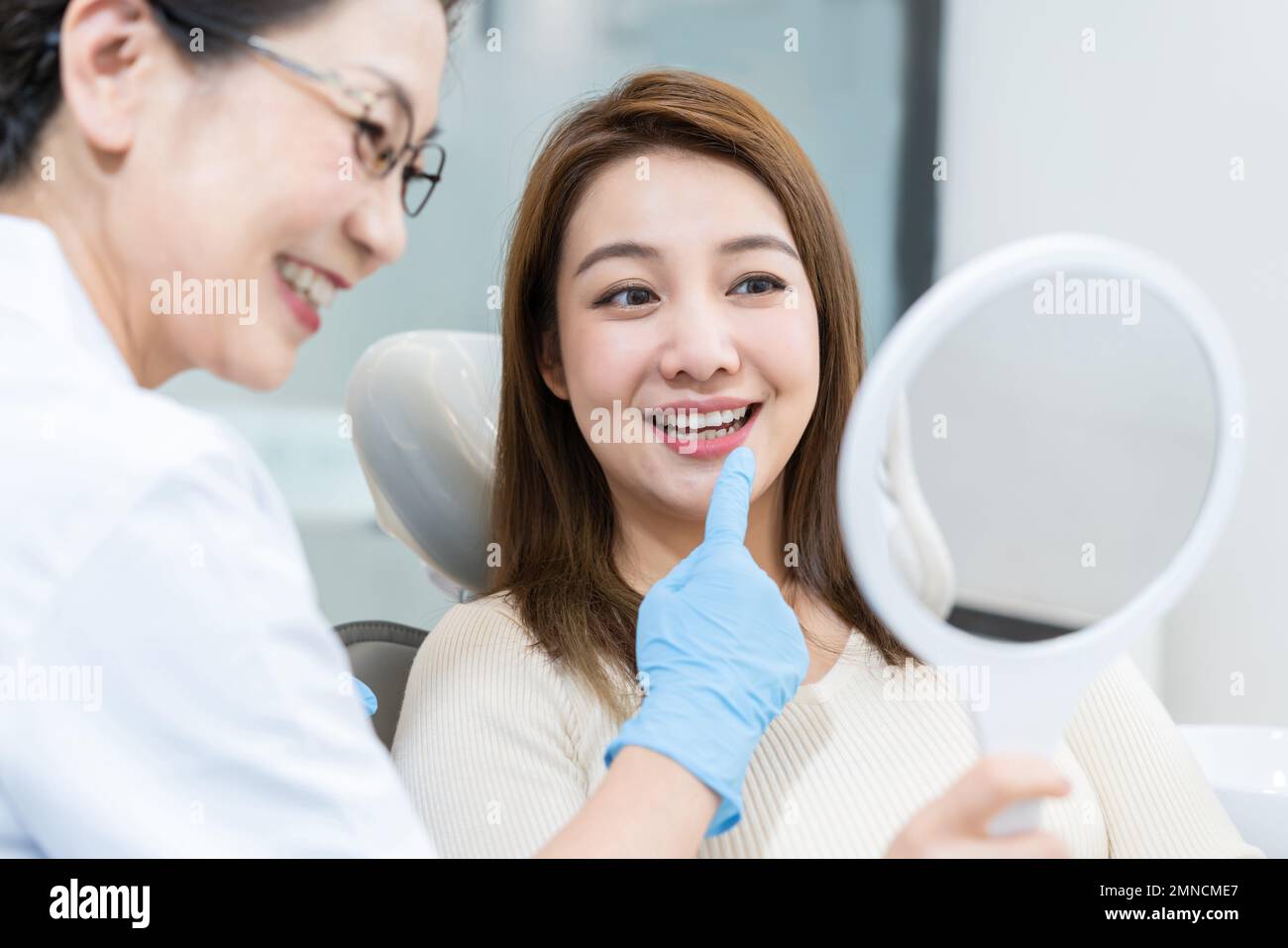 Doctors give patients in the dental clinic matching teeth Stock Photo ...