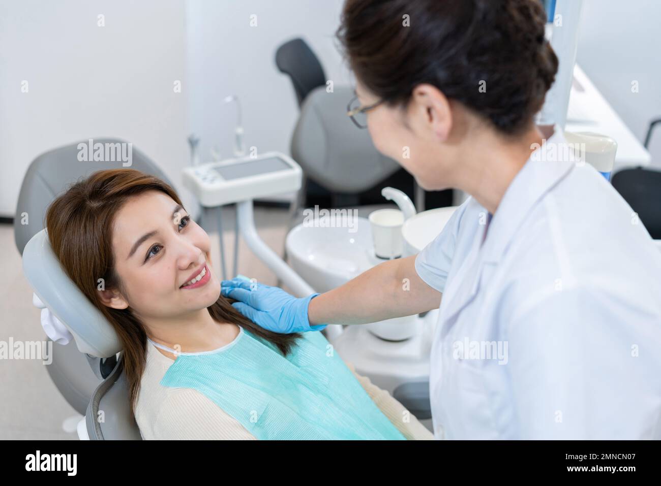 Doctors and patients in dental clinic Stock Photo - Alamy