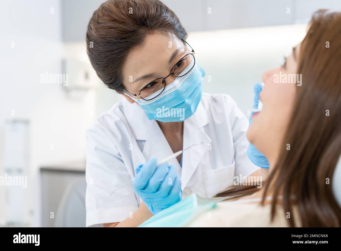 Doctors and patients in dental clinic Stock Photo - Alamy