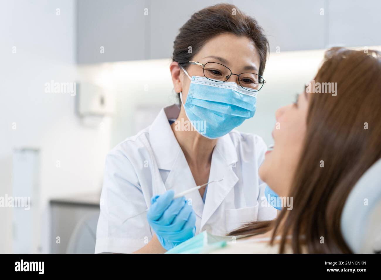 Doctors and patients in dental clinic Stock Photo - Alamy