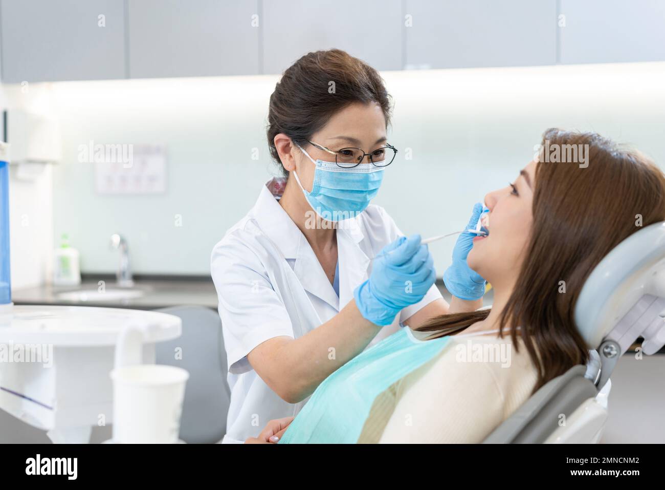Doctors and patients in dental clinic Stock Photo - Alamy