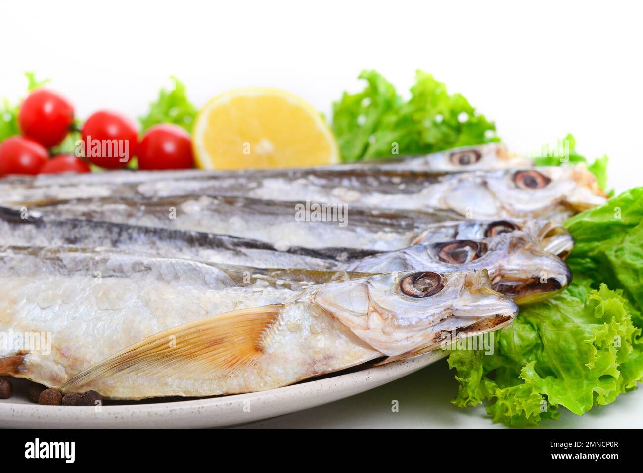 Group of dried fish at plate . Seafood Stock Photo - Alamy