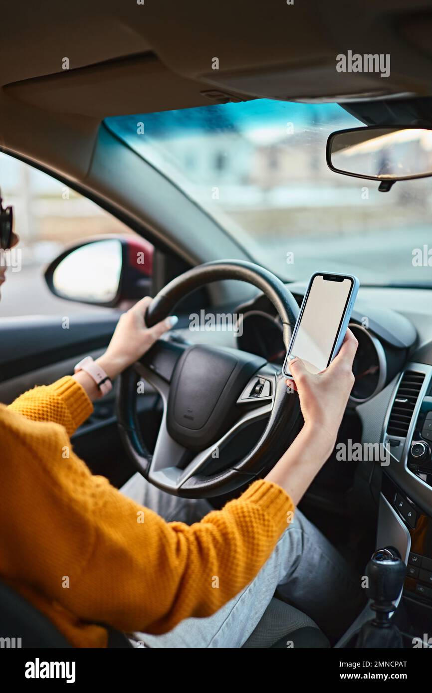 Hands unrecognizable woman driver using hi-res stock photography and ...