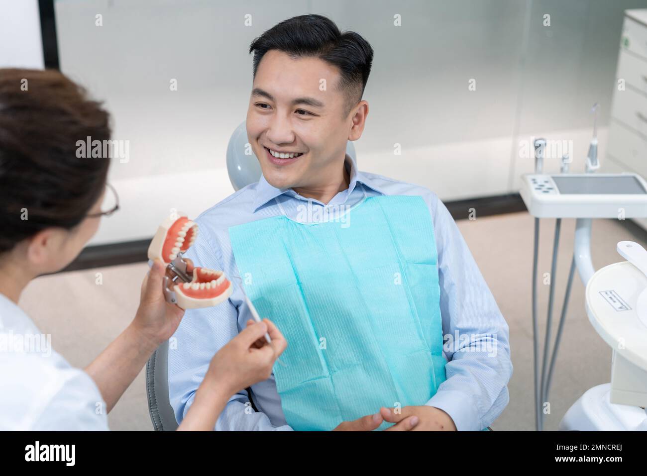 Doctors and patients in dental clinic Stock Photo - Alamy
