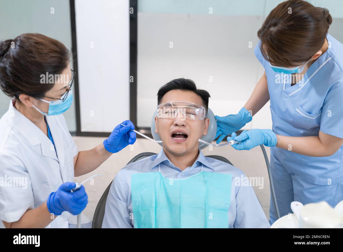 Doctors and patients in dental clinic Stock Photo - Alamy