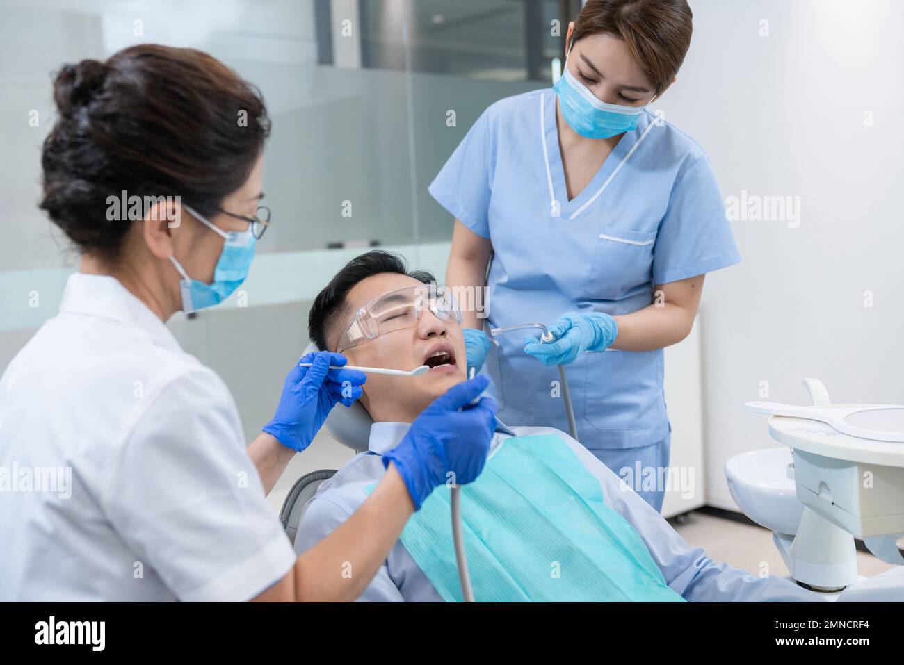 Doctors and patients in dental clinic Stock Photo - Alamy