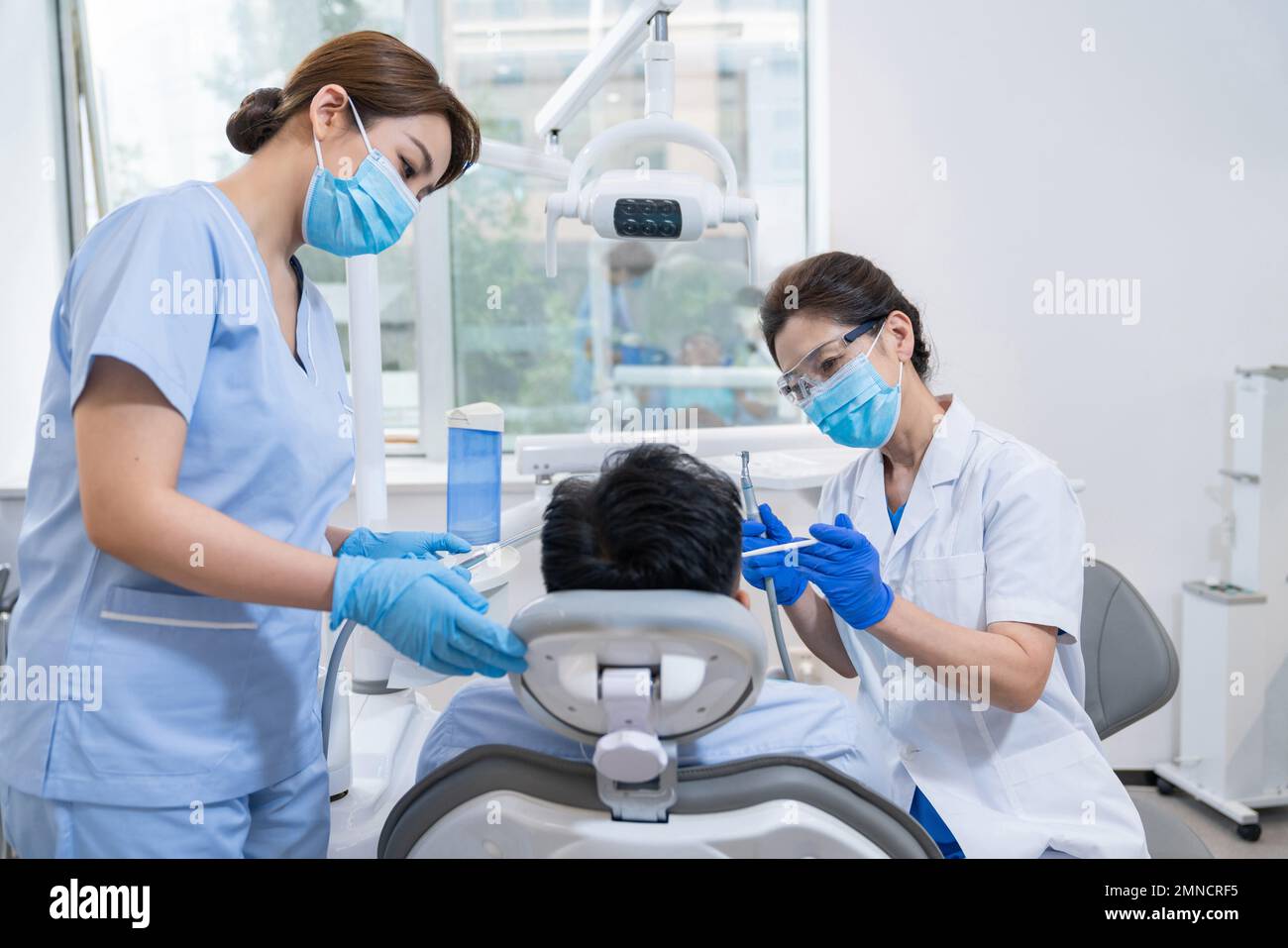 Doctors and patients in dental clinic Stock Photo - Alamy