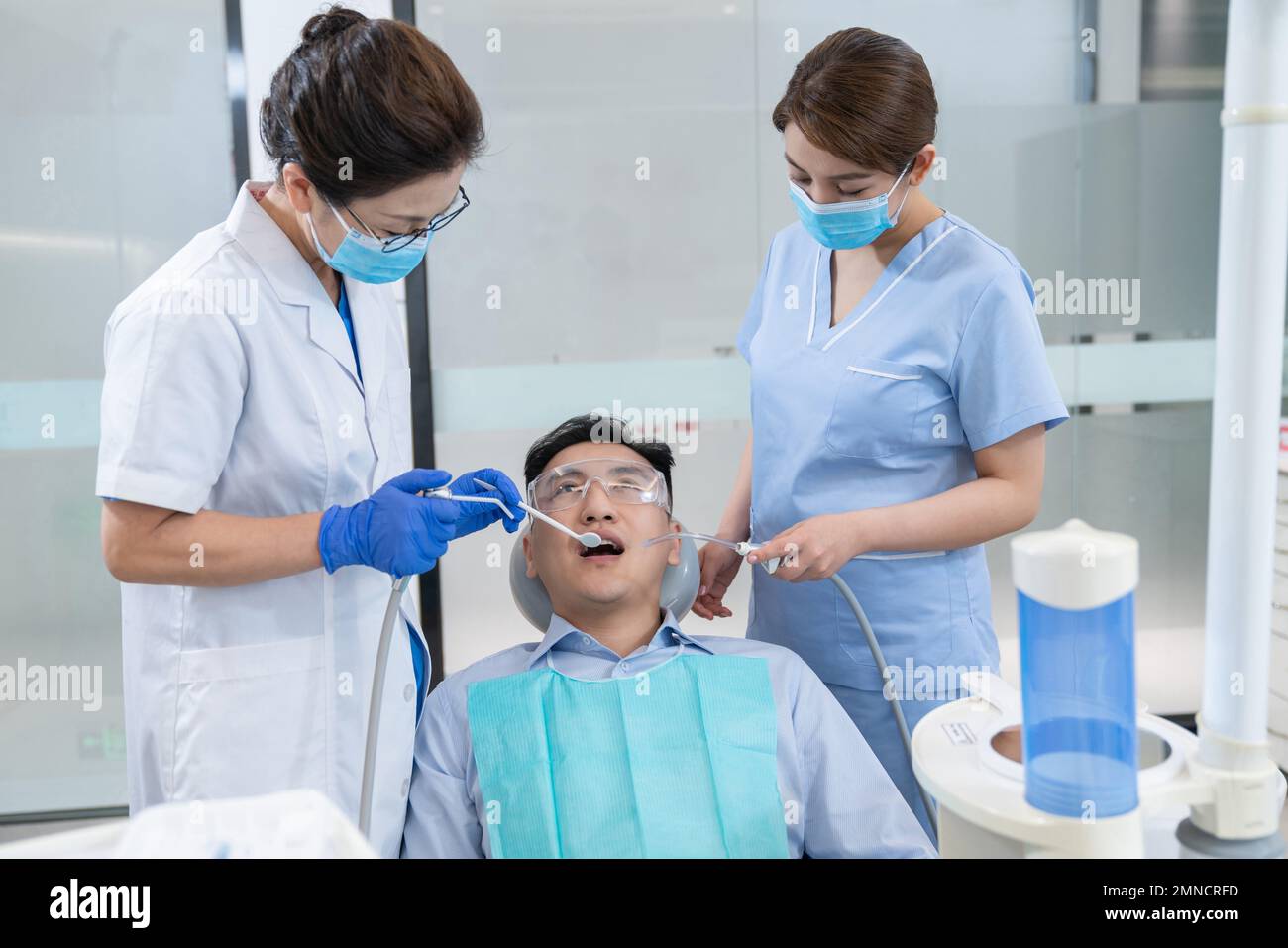 Doctors and patients in dental clinic Stock Photo - Alamy