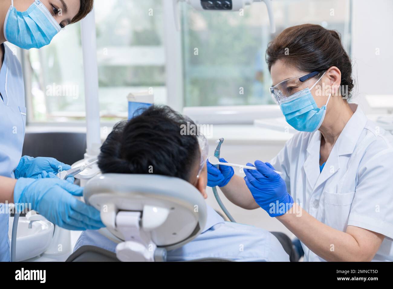 Doctors and patients in dental clinic Stock Photo - Alamy