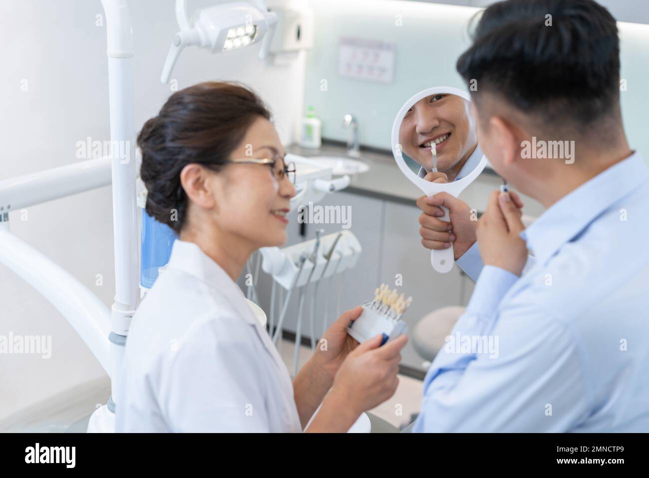 Doctors and patients in dental clinic Stock Photo - Alamy