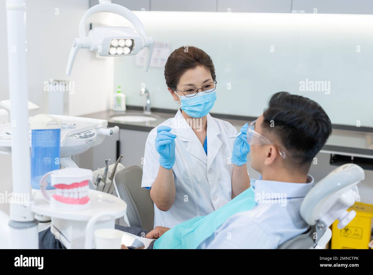 Doctors and patients in dental clinic Stock Photo - Alamy