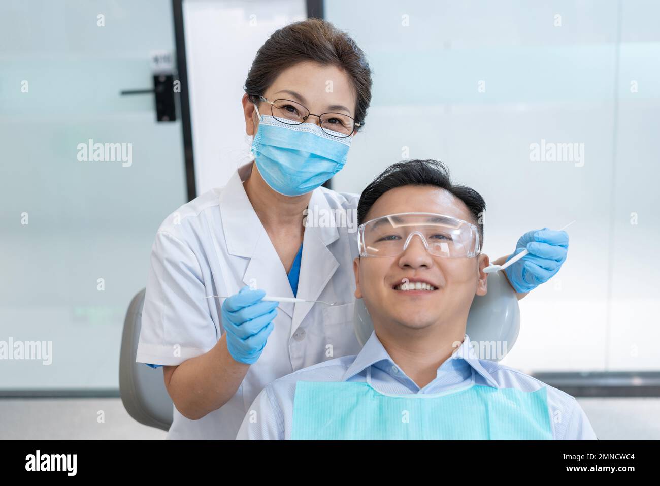 Doctors and patients in dental clinic Stock Photo - Alamy