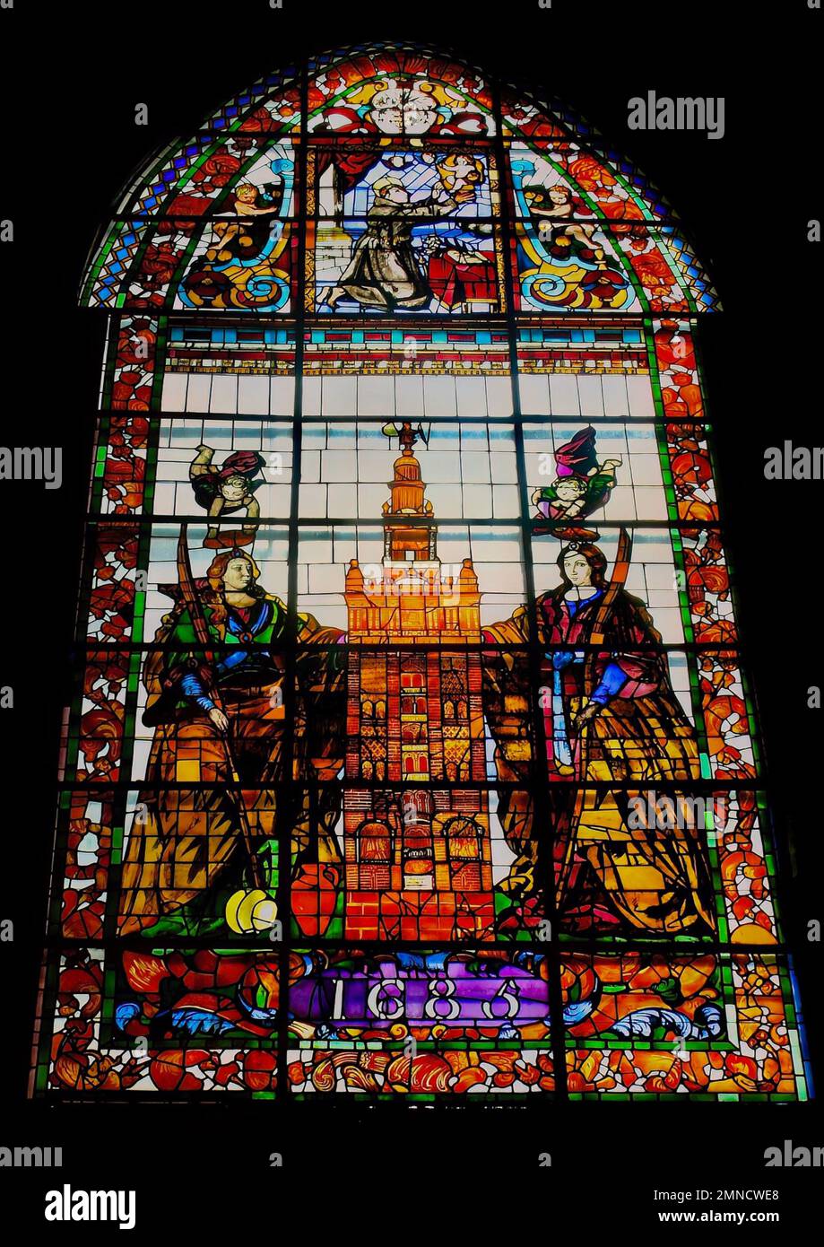 Stained glass window in the Baptistry Chapel featuring the Giralda ...