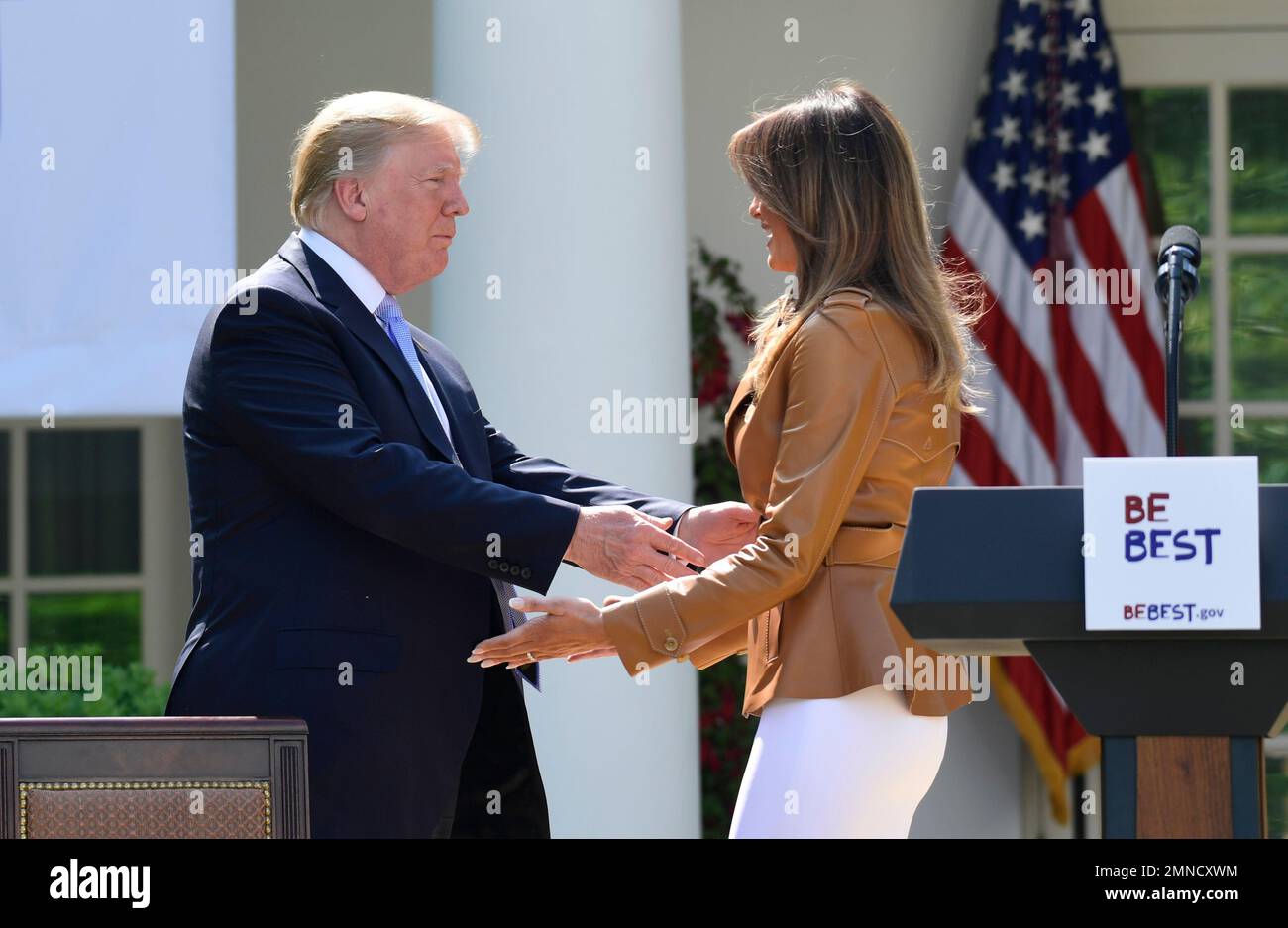 President Donald Trump reaches out to hug first lady Melania Trump ...