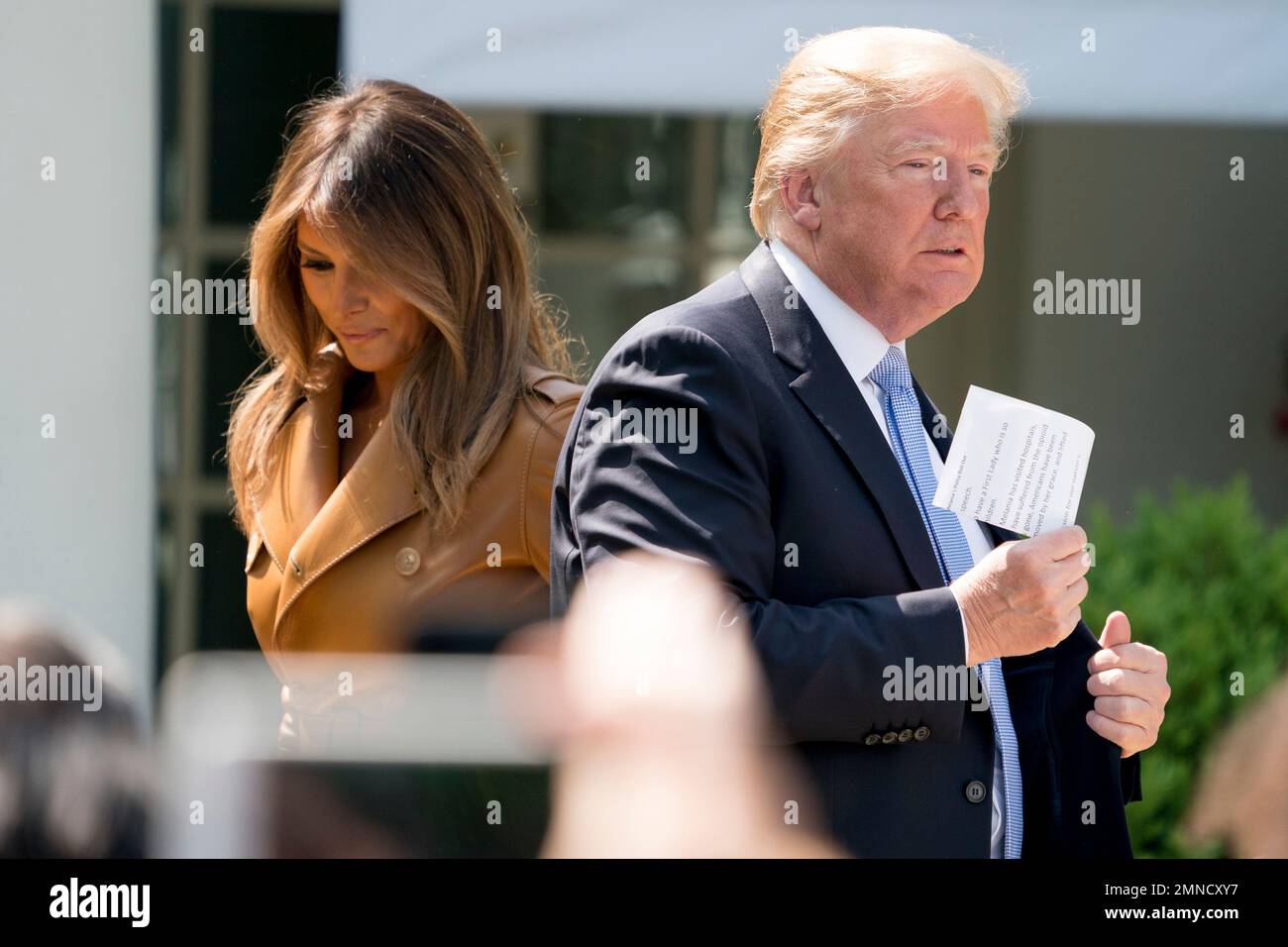 President Donald Trump, accompanied by first lady Melania Trump, takes ...