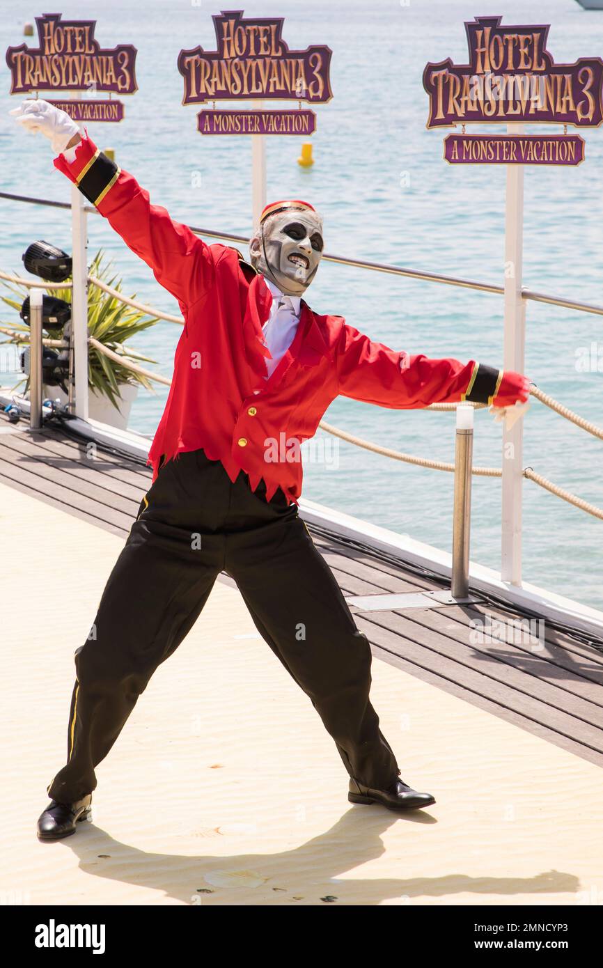 A performer dressed as zombie poses for photographers during a photo ...