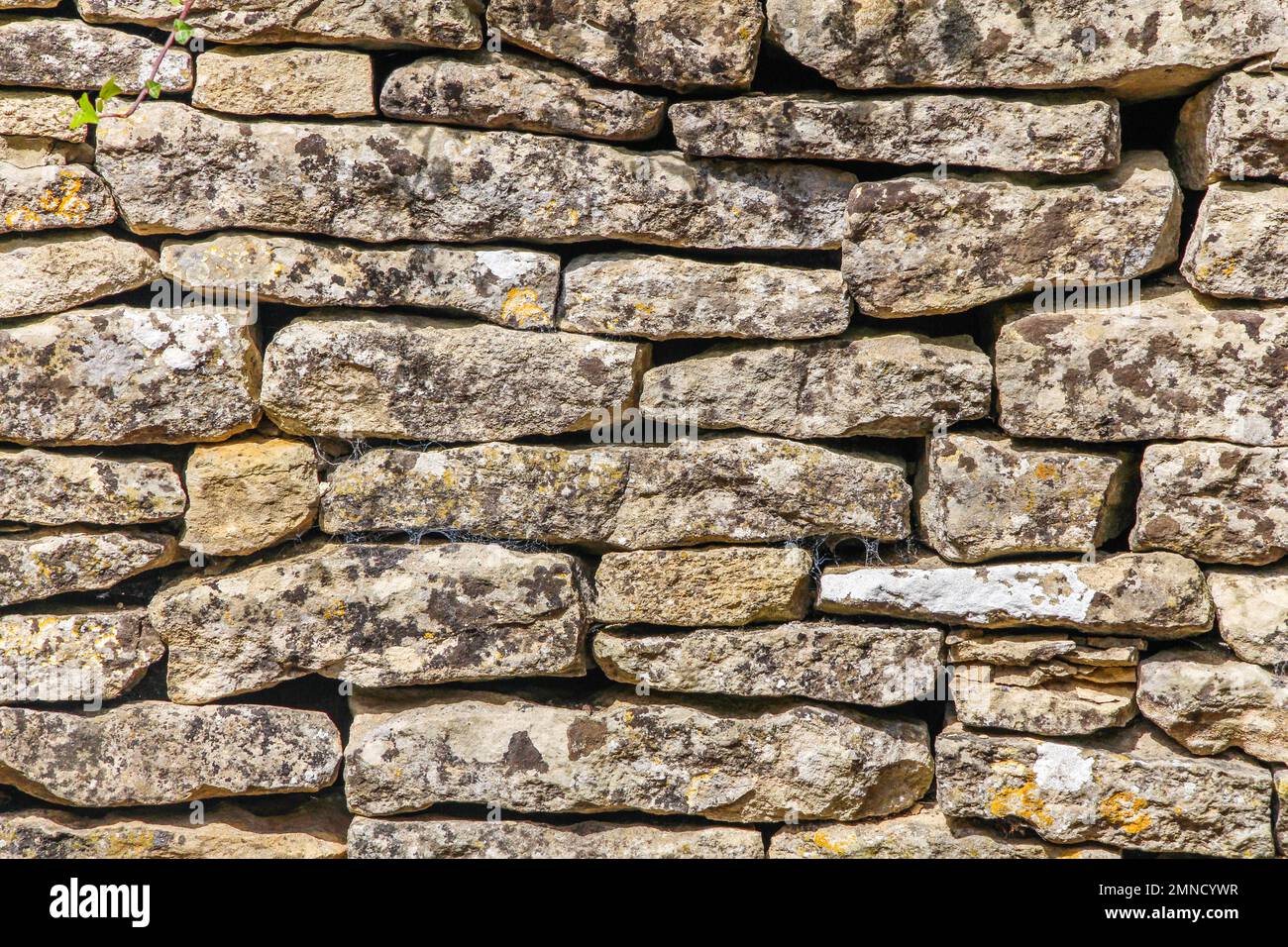 An old cobbled wall, stone masonry. Abstract natural backgrounds and ...