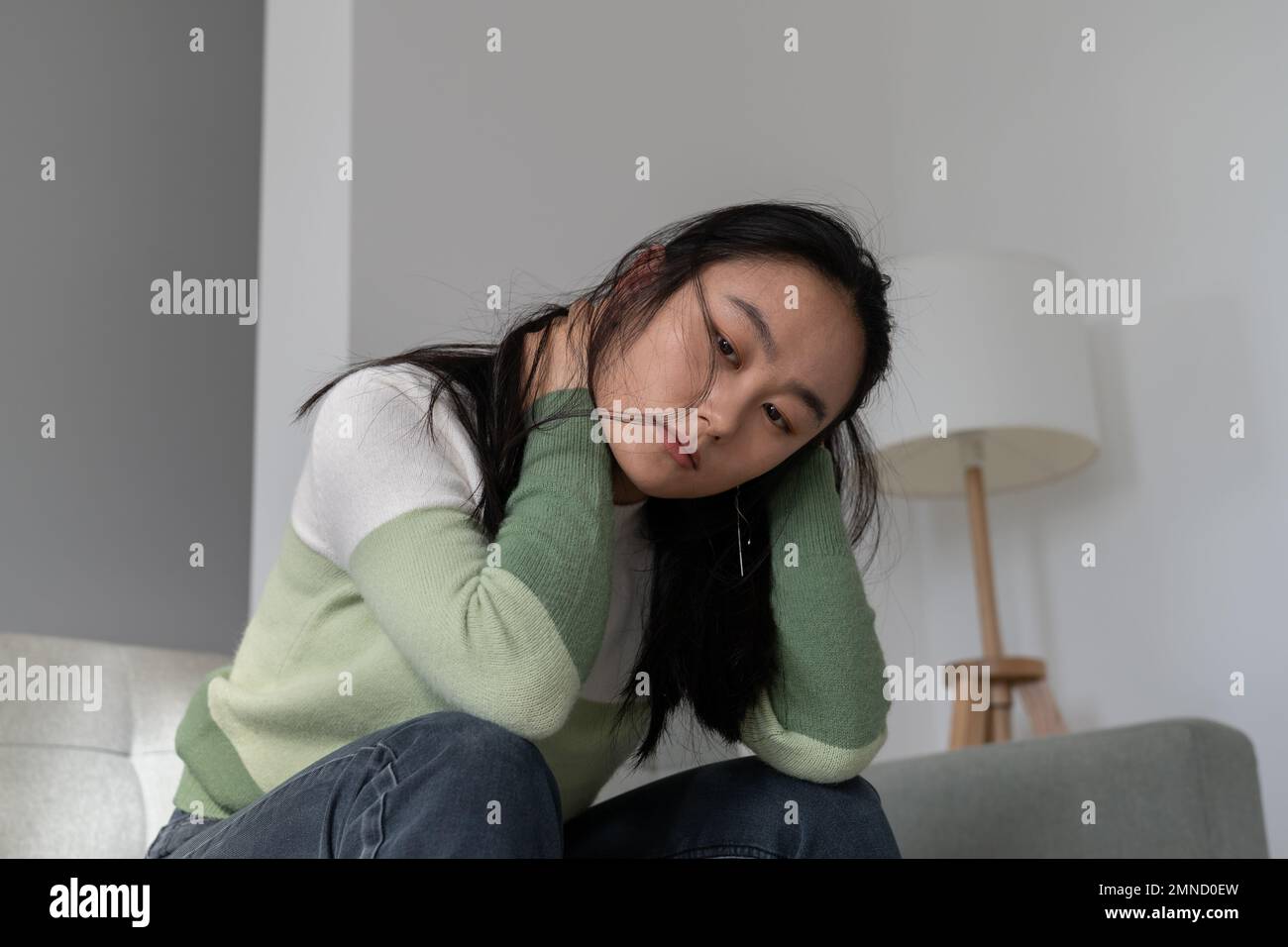 Depressed despondent Asian girl suffering from stress after failure in ...