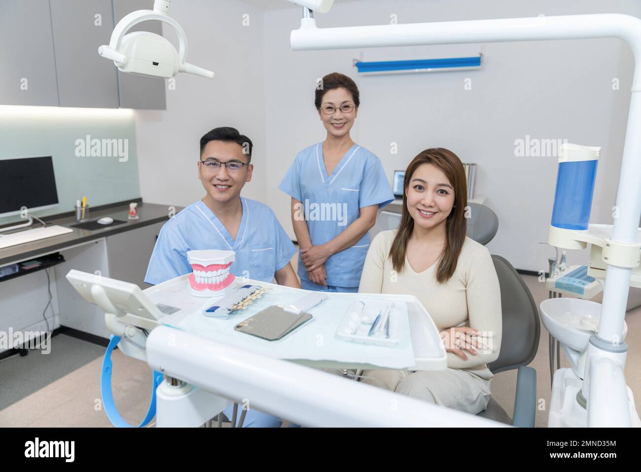 Doctors and patients in dental clinic Stock Photo - Alamy