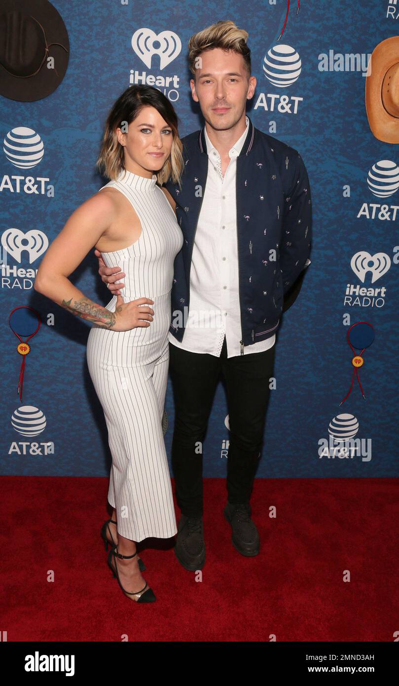 Cassadee Pope Left And Sam Palladio Arrive At The Iheartcountry Festival At The Frank Erwin