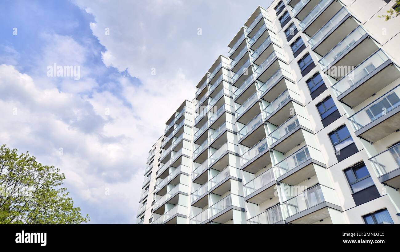 Futuristic square architecture of apartment building. Real estate with ...