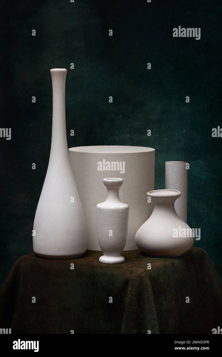 Still life with white vases and white figures Stock Photo - Alamy