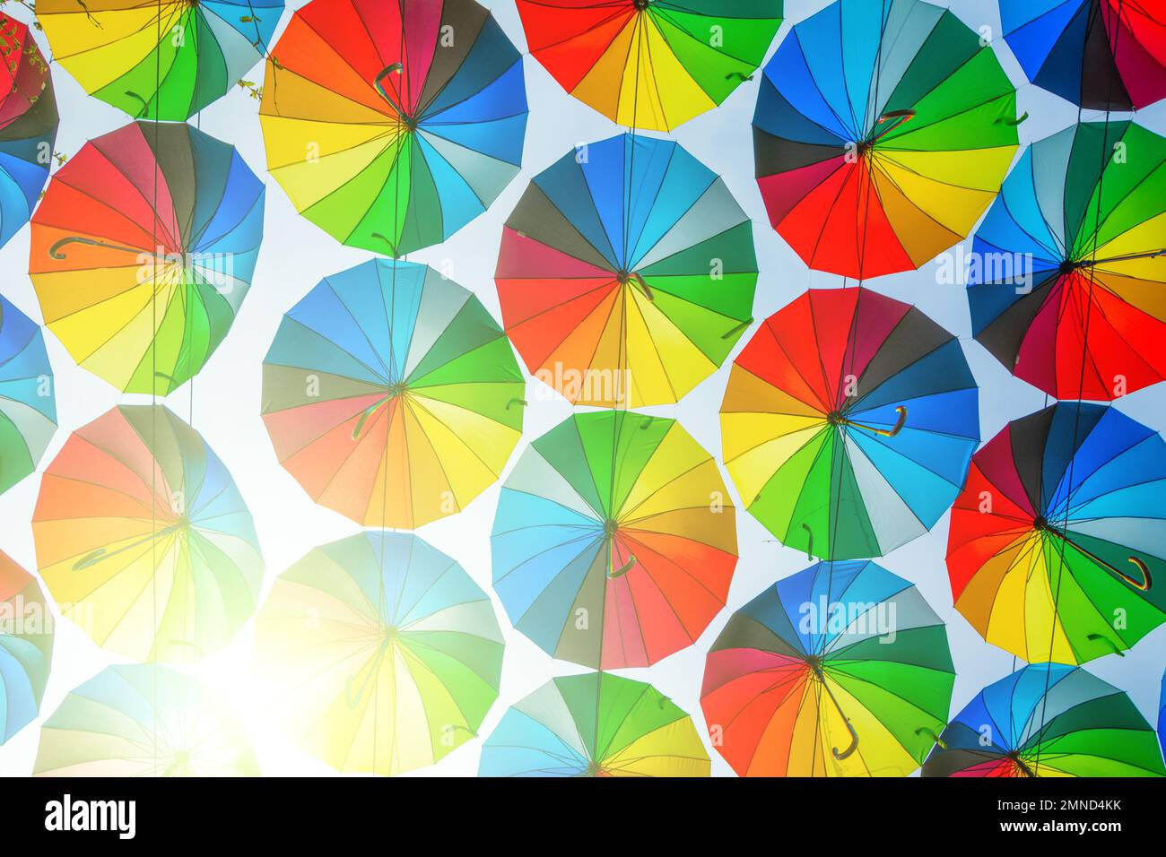 Bright colored umbrellas as a joyful background Stock Photo - Alamy