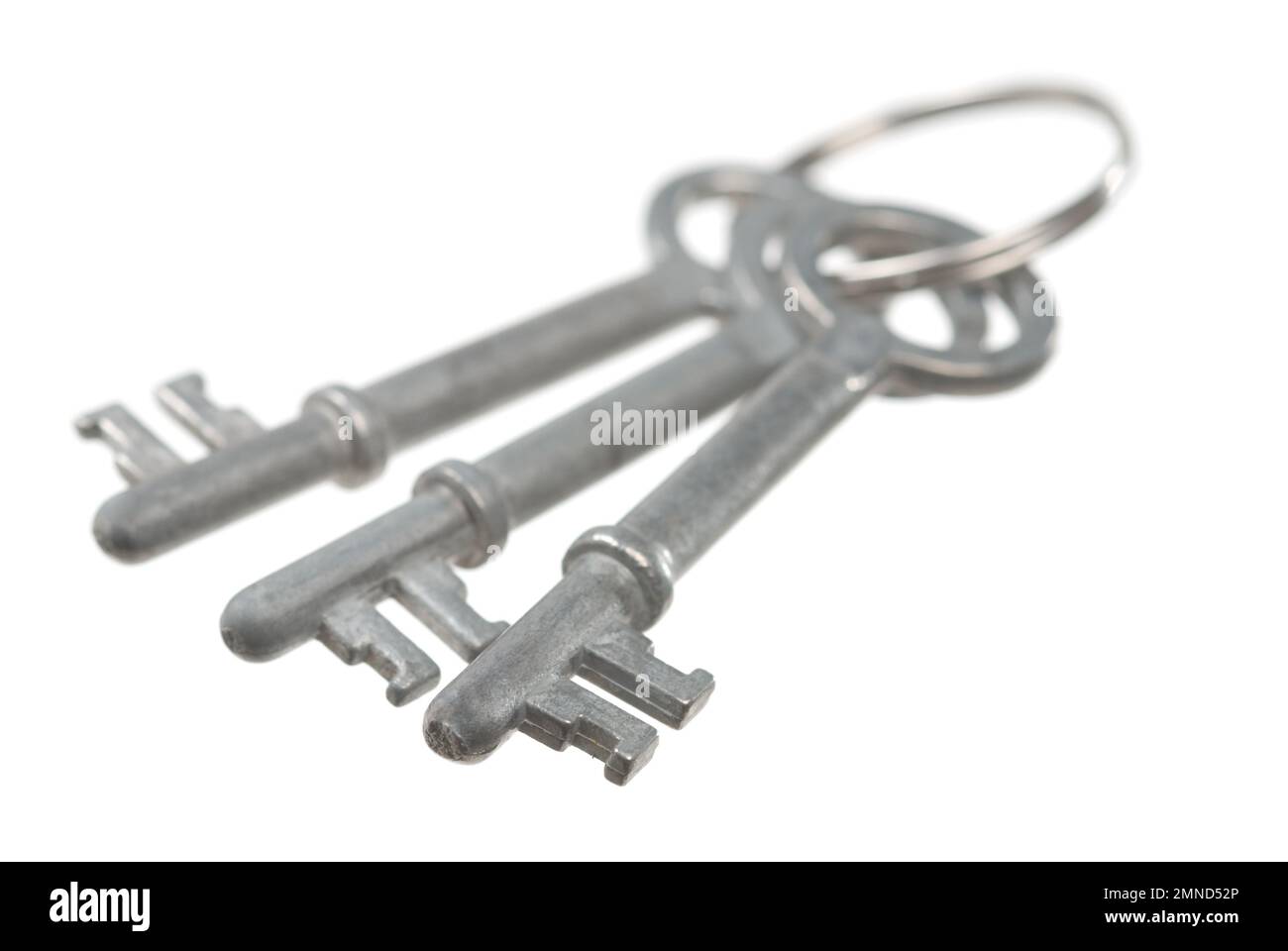 A bunch of old keys on white Stock Photo - Alamy
