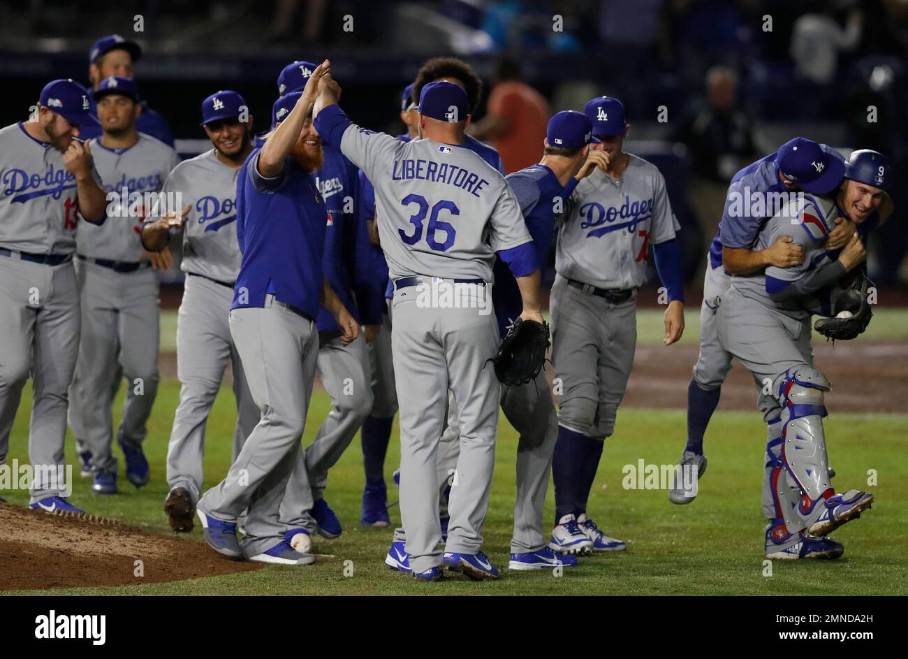 Los Angeles Dodgers catcher Yasmani Grandal, right, and relief pitcher ...