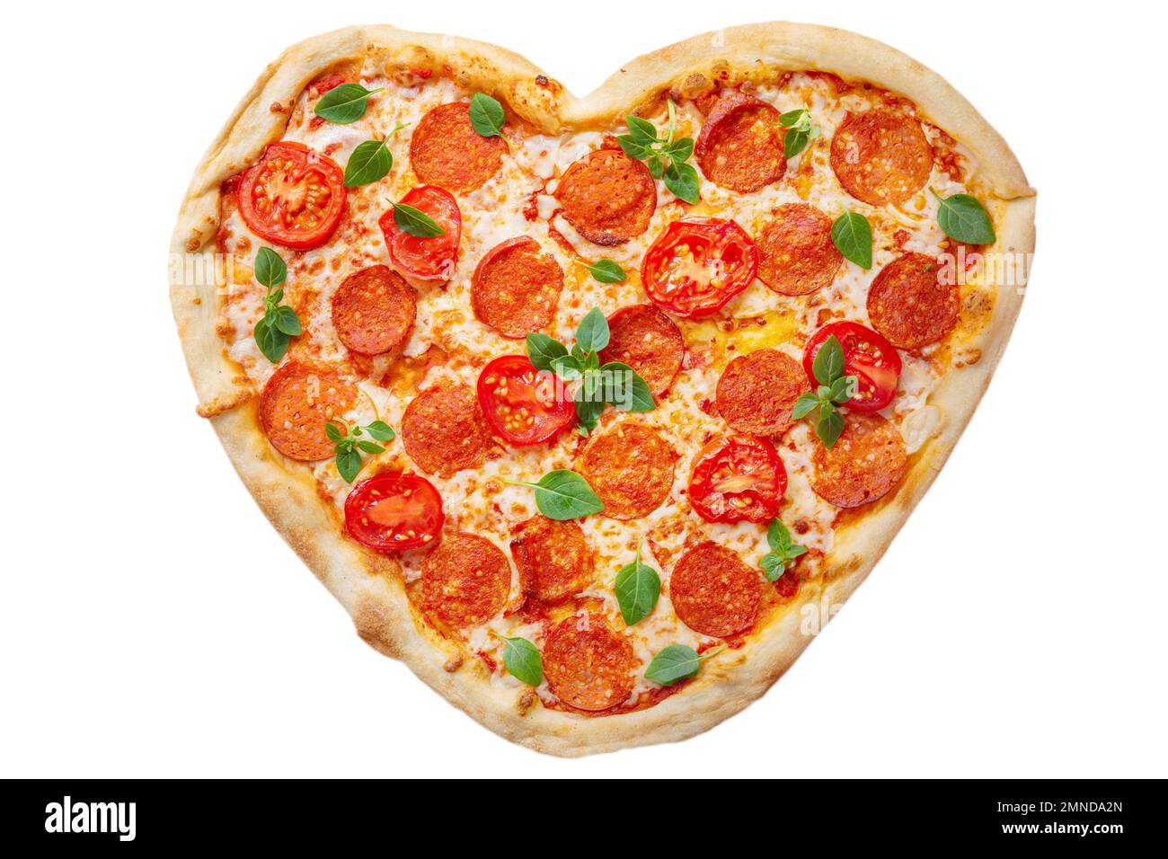 Heart shapped pepperoni pizza with green basil isolated on white ...