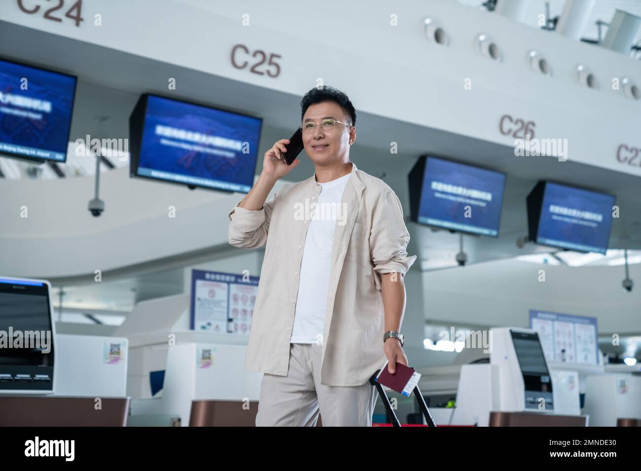 Older men call at the airport Stock Photo - Alamy