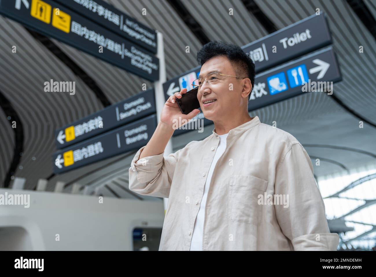 Older men call at the airport Stock Photo - Alamy