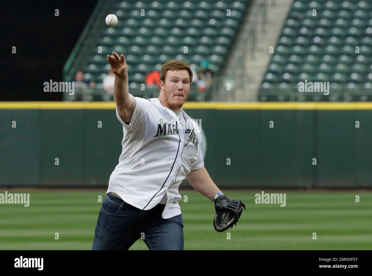 NFL football Seattle Seahawks' Ethan Pocic throws out the ceremonial ...