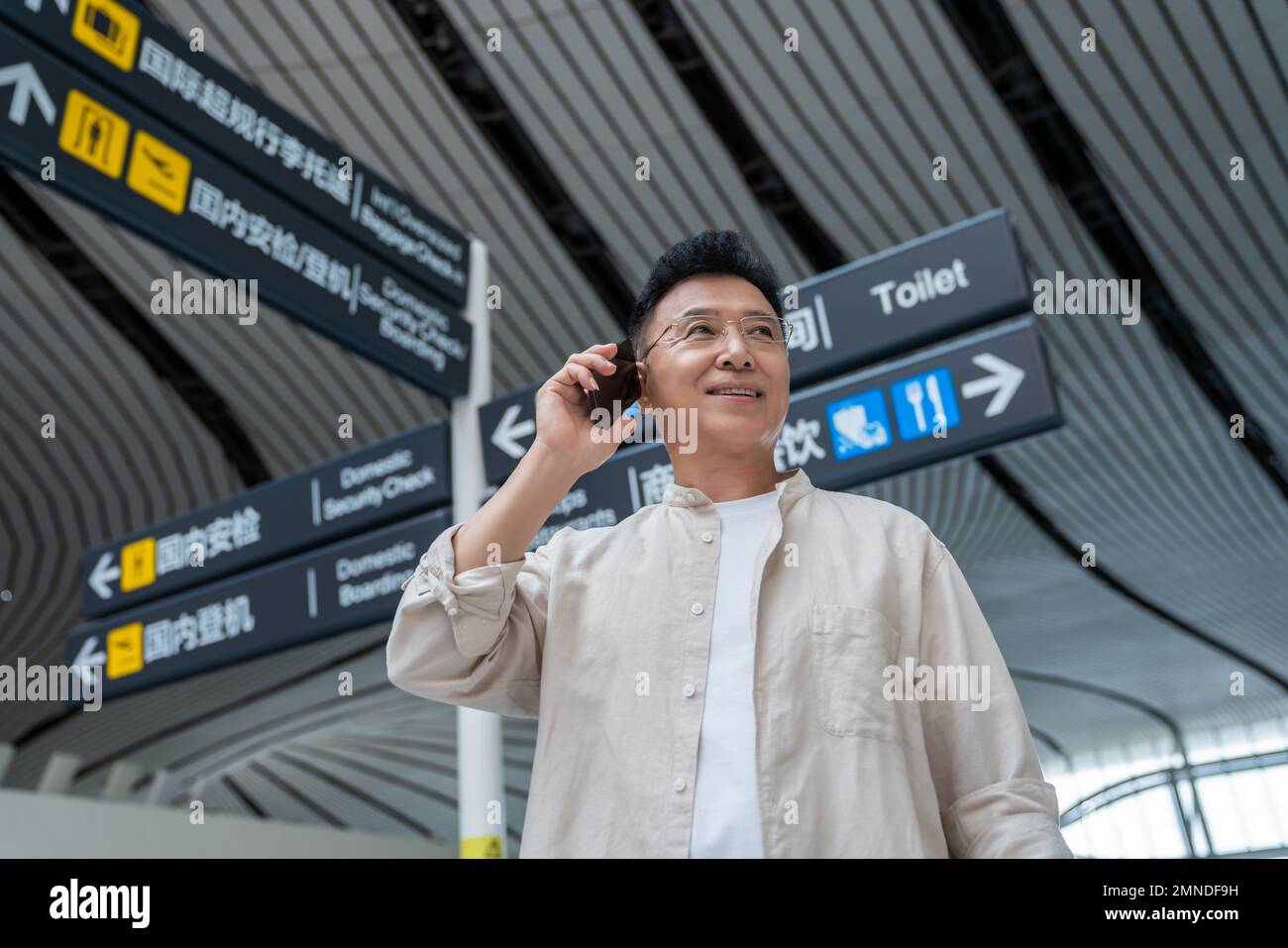 Older men call at the airport Stock Photo - Alamy