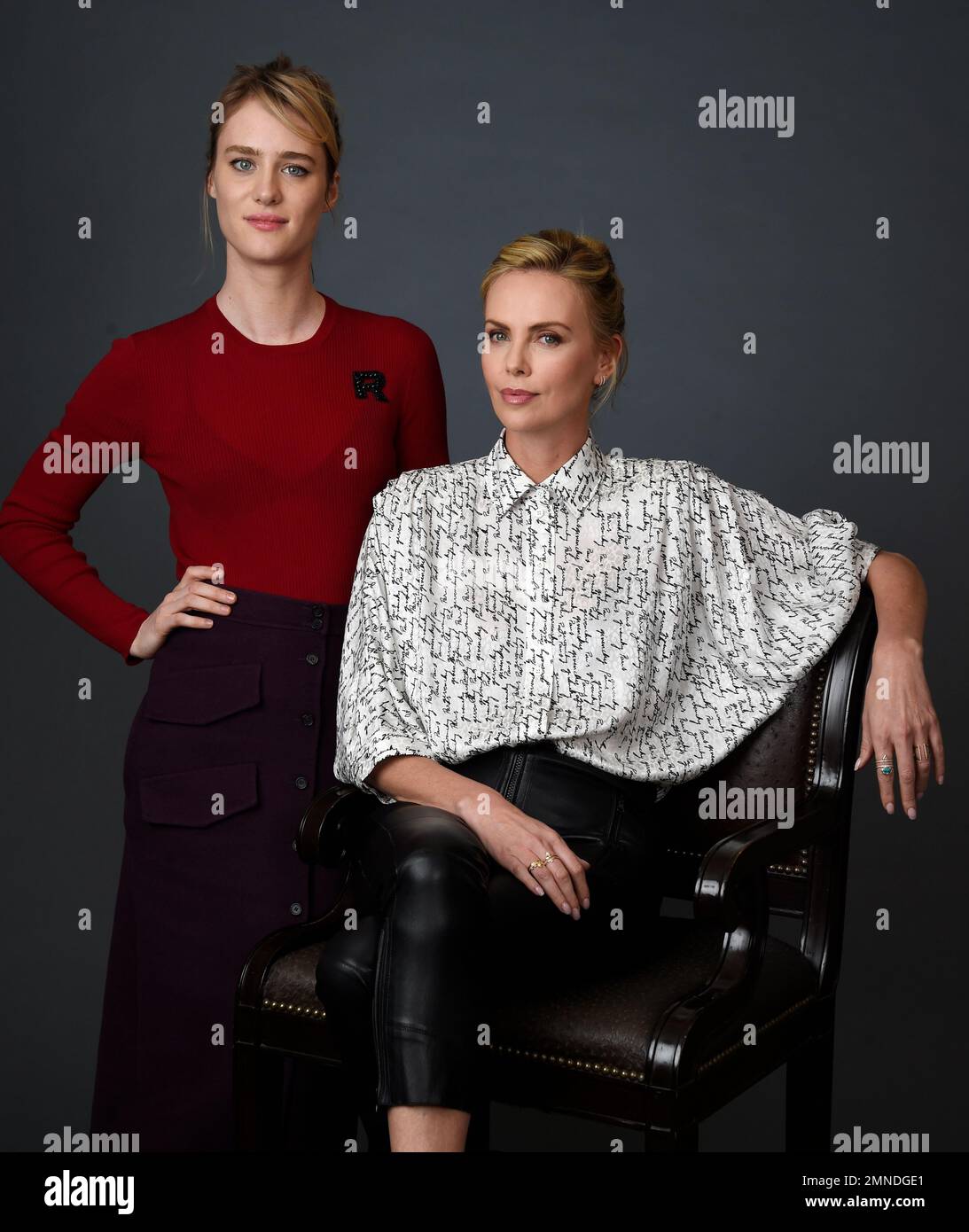 In this April 17, 2018 photo, Charlize Theron, right, and Mackenzie ...