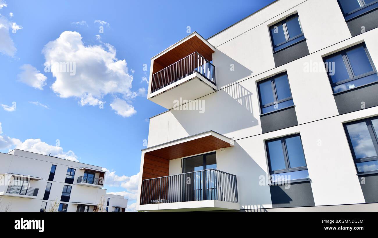 Futuristic square architecture of apartment building. Real estate with ...