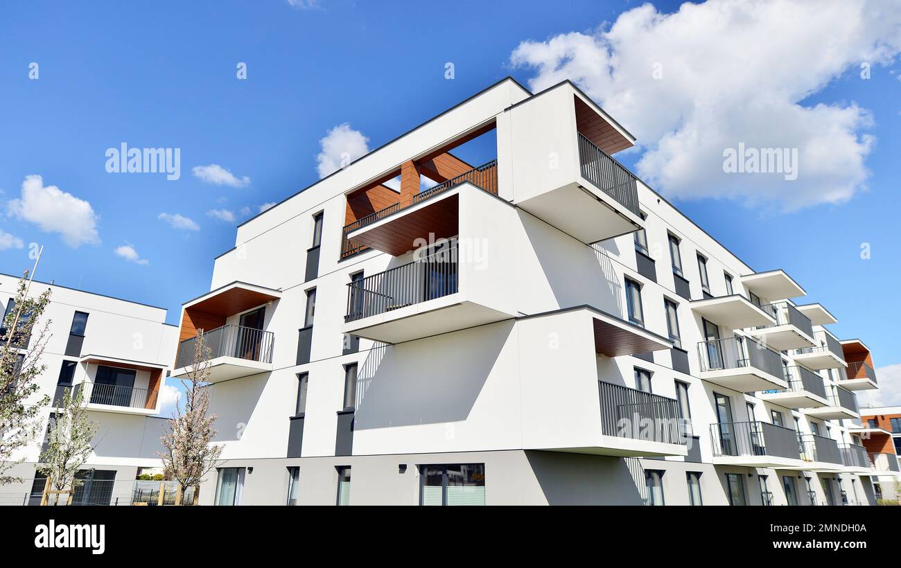 Futuristic square architecture of apartment building. Real estate with ...