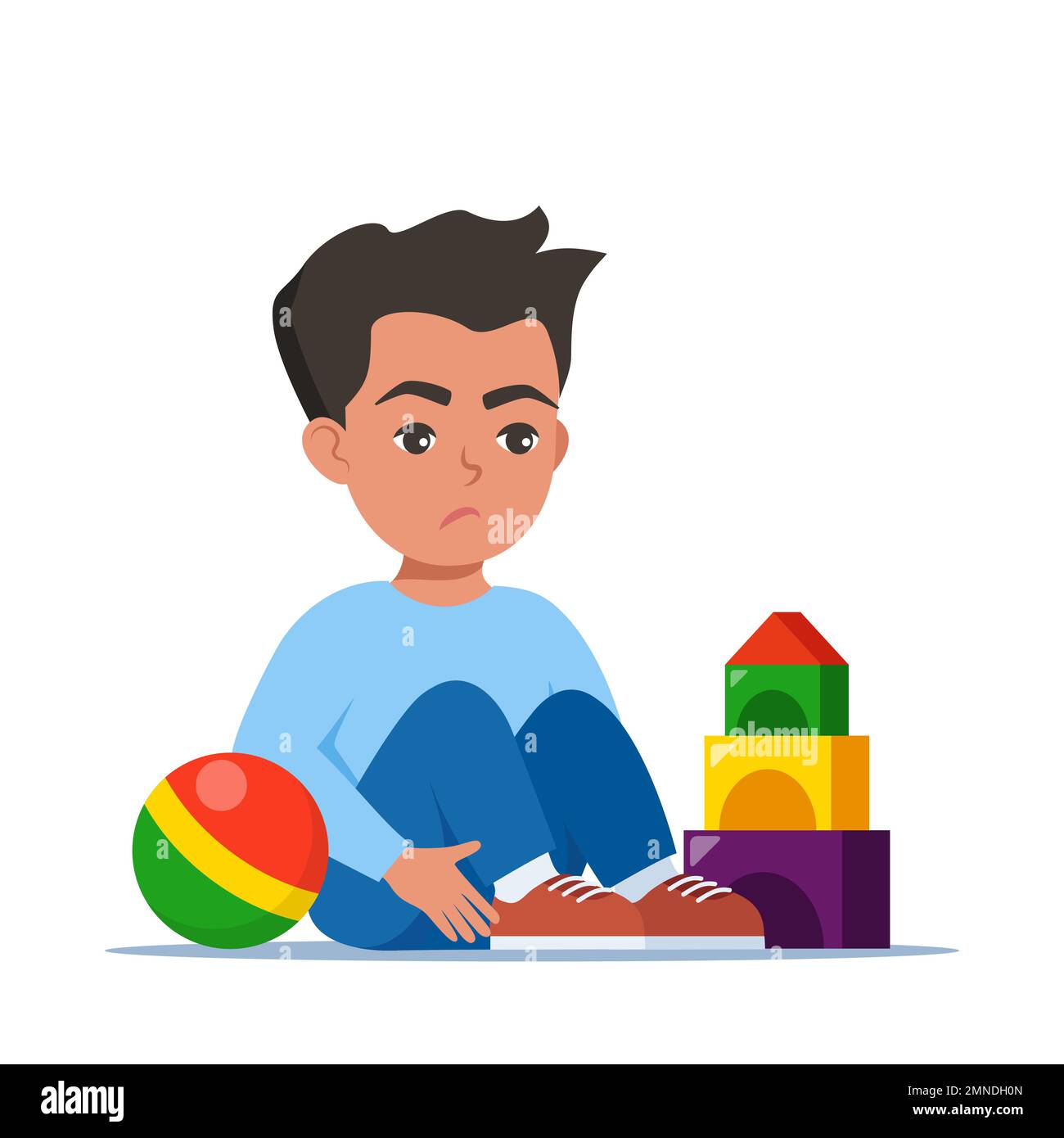 Sad boy sitting on floor surrounded by toys. Autism, child stress ...