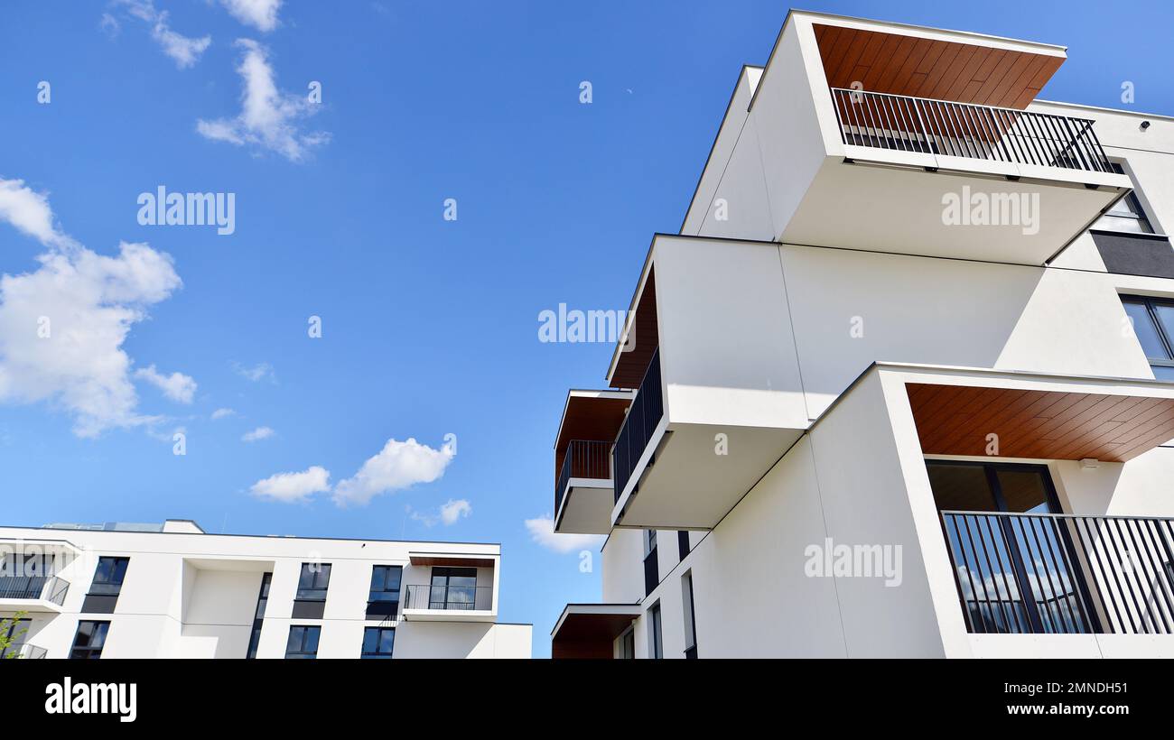 Futuristic square architecture of apartment building. Real estate with ...