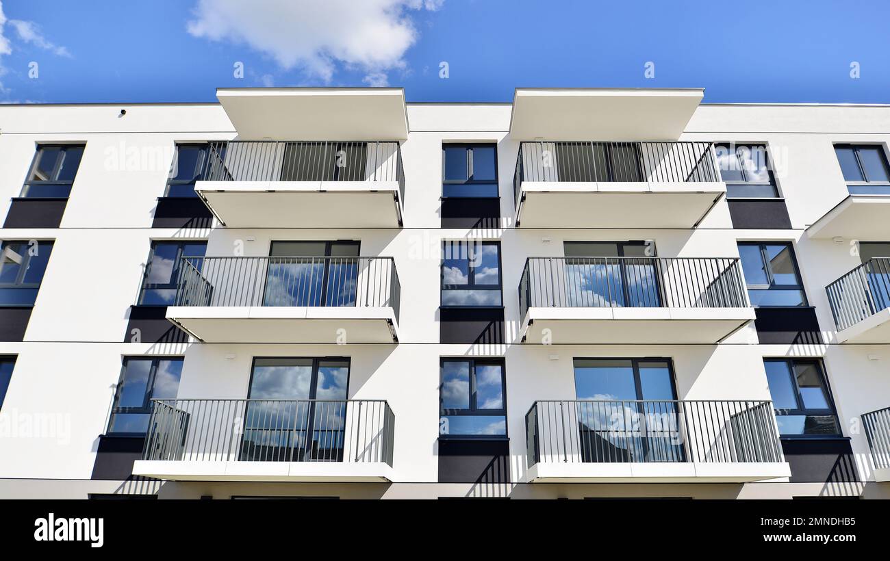 Futuristic square architecture of apartment building. Real estate with ...