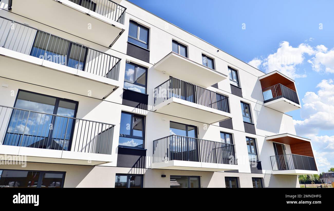 Futuristic square architecture of apartment building. Real estate with ...