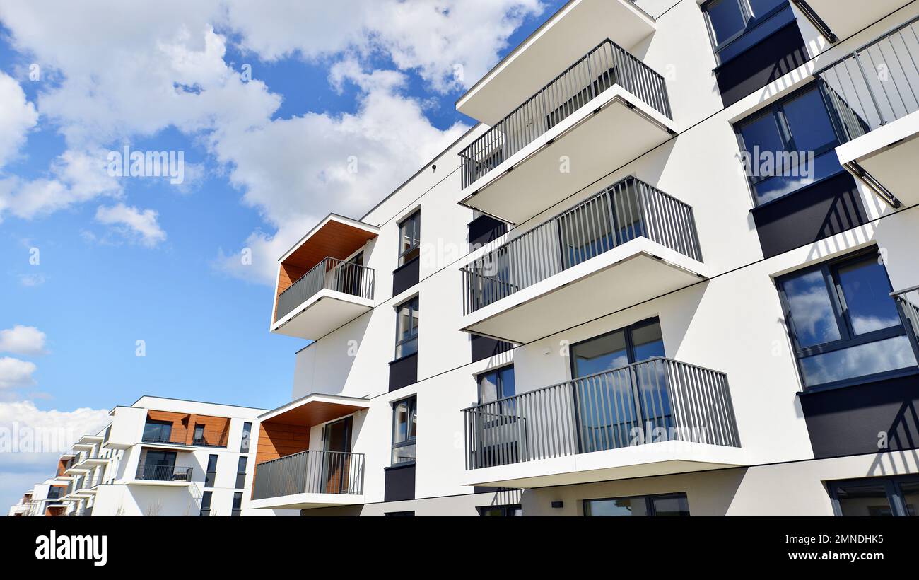 Futuristic square architecture of apartment building. Real estate with ...